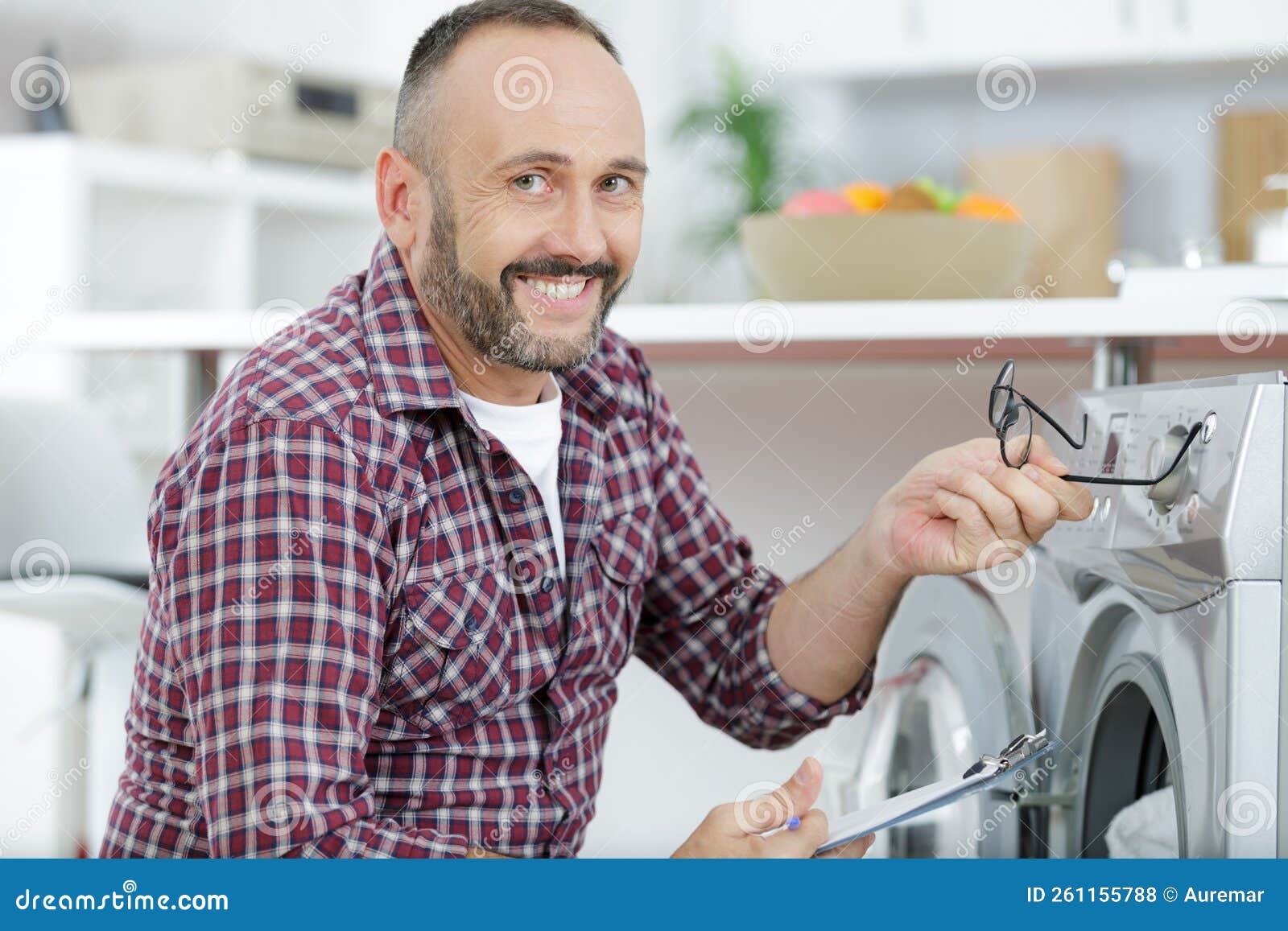 Man Doing Washing Machine Load Stock Photo - Image of housewife ...