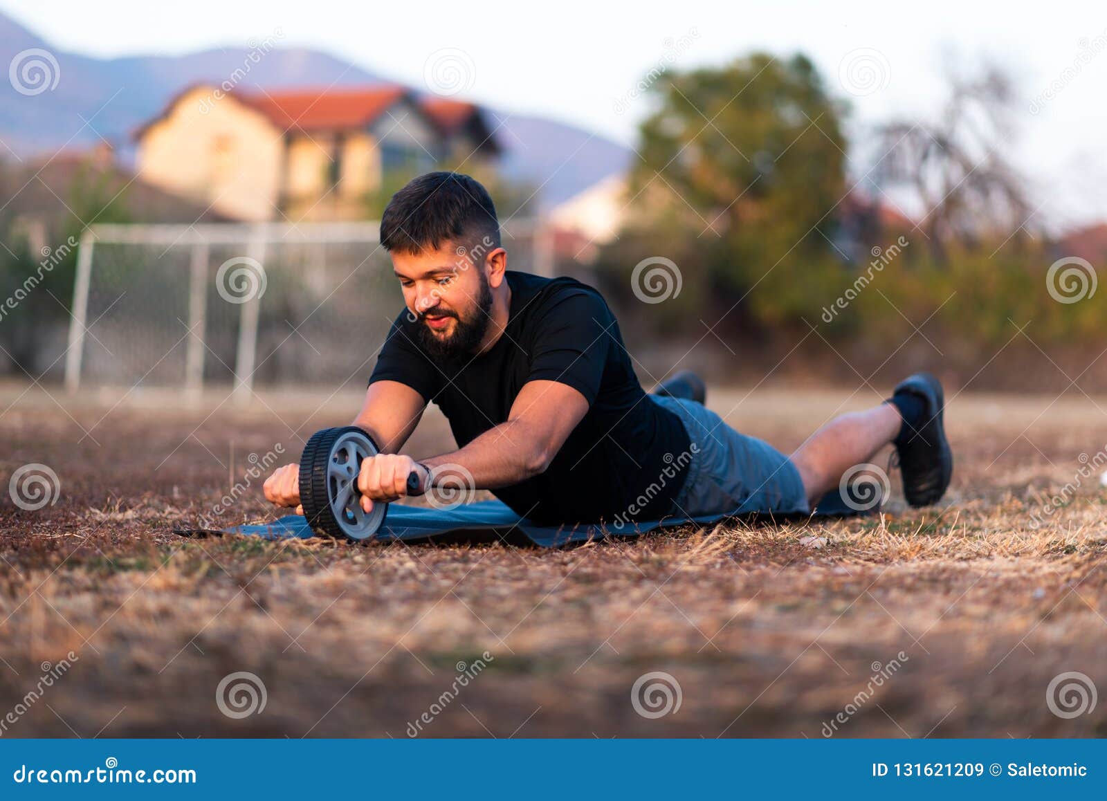 Man Doing a Workout with Ab Roller Stock Image - Image of active ...
