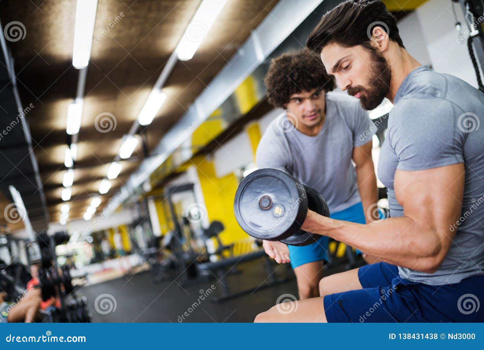 Man Doing Workout with a Personal Trainer. Stock Photo - Image of notes ...