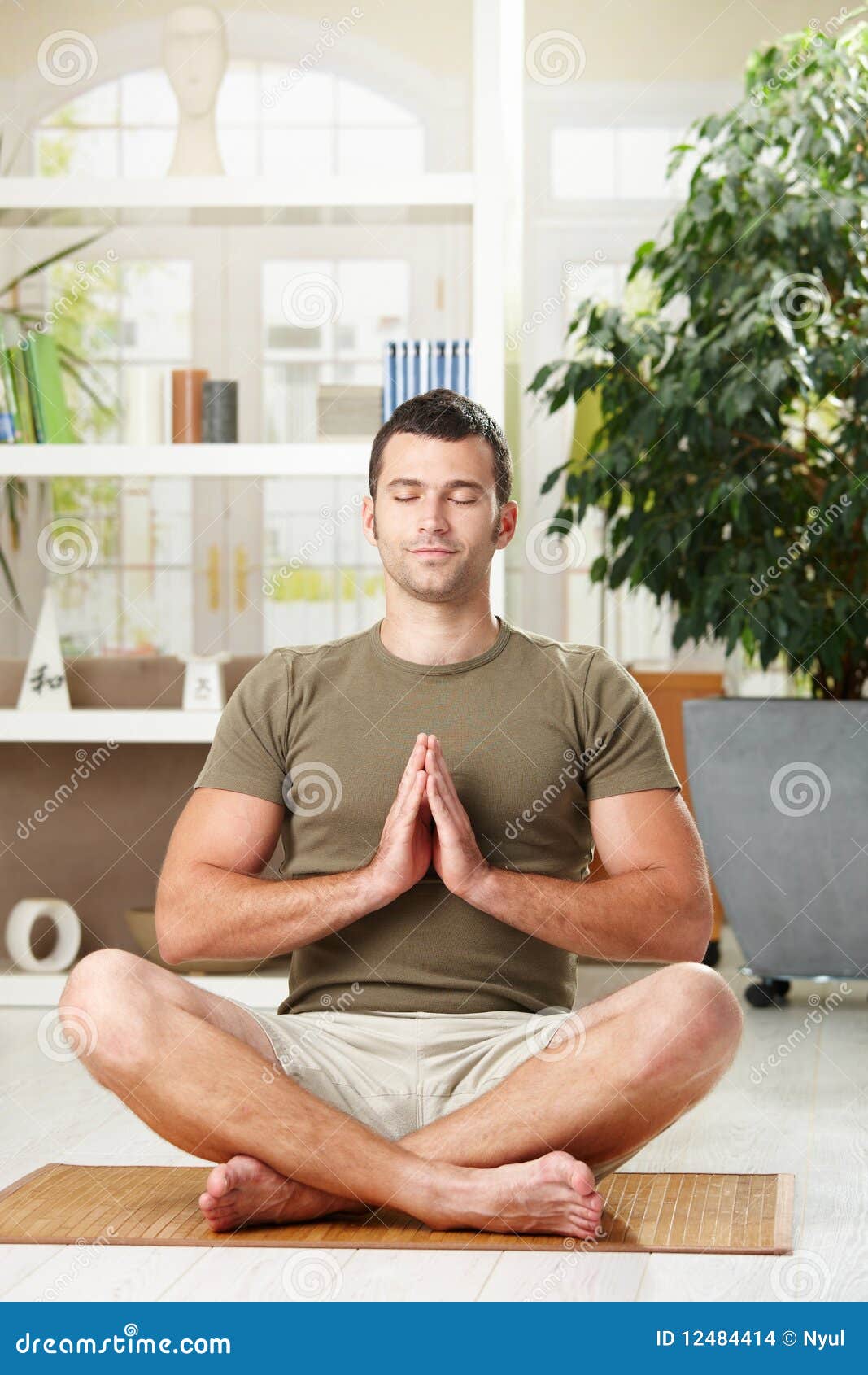 Man doing yoga exercise stock photo. Image of alone, apartment - 12484414