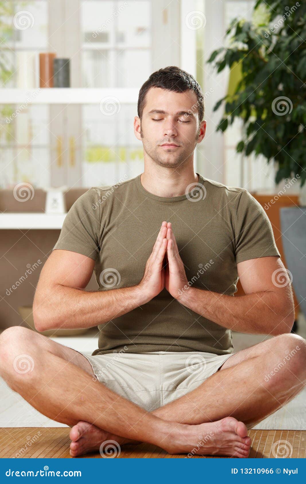 Man doing yoga exercise stock photo. Image of health - 13210966