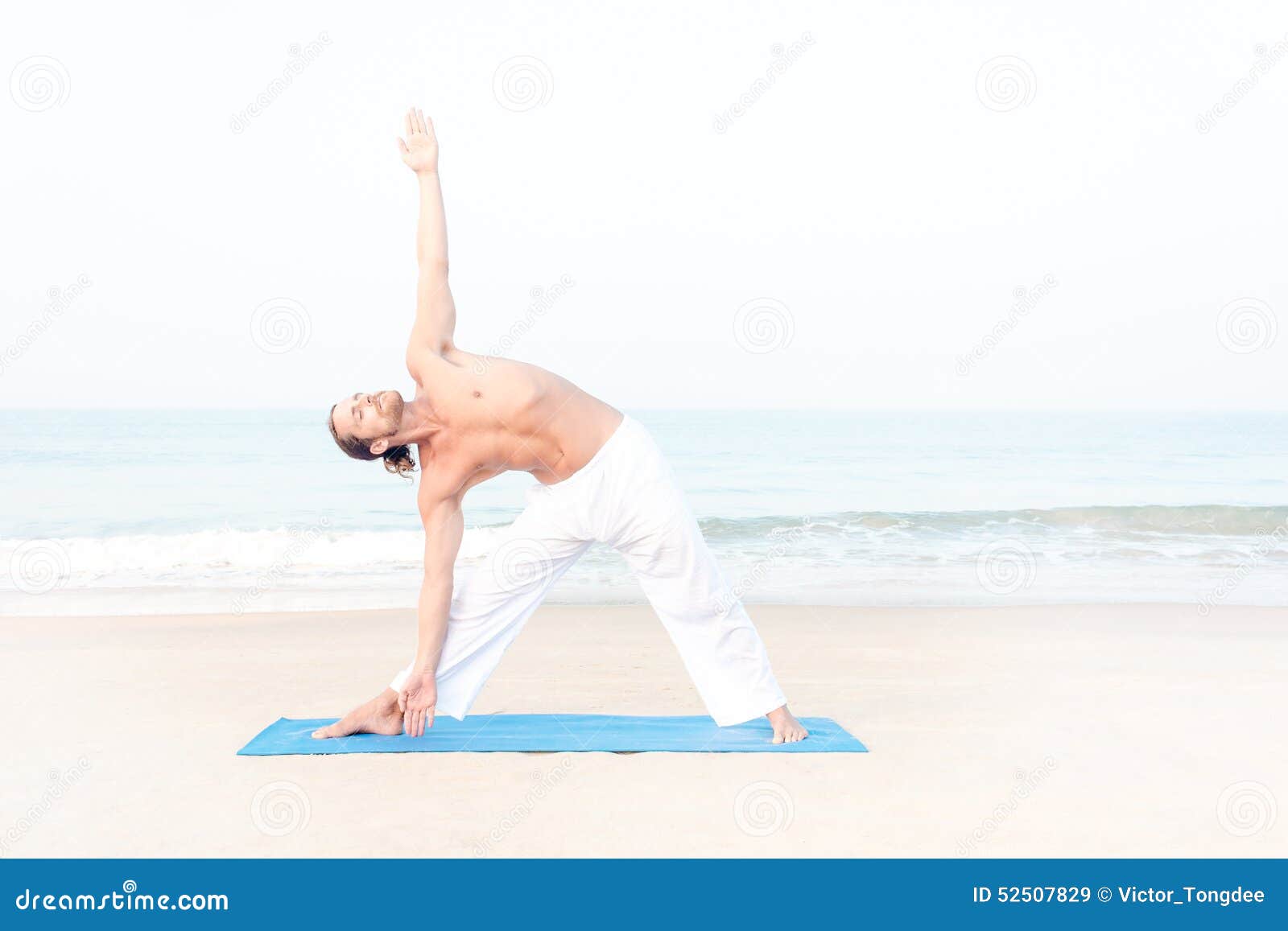 Man doing yoga stock image. Image of seashore, sport - 52507829