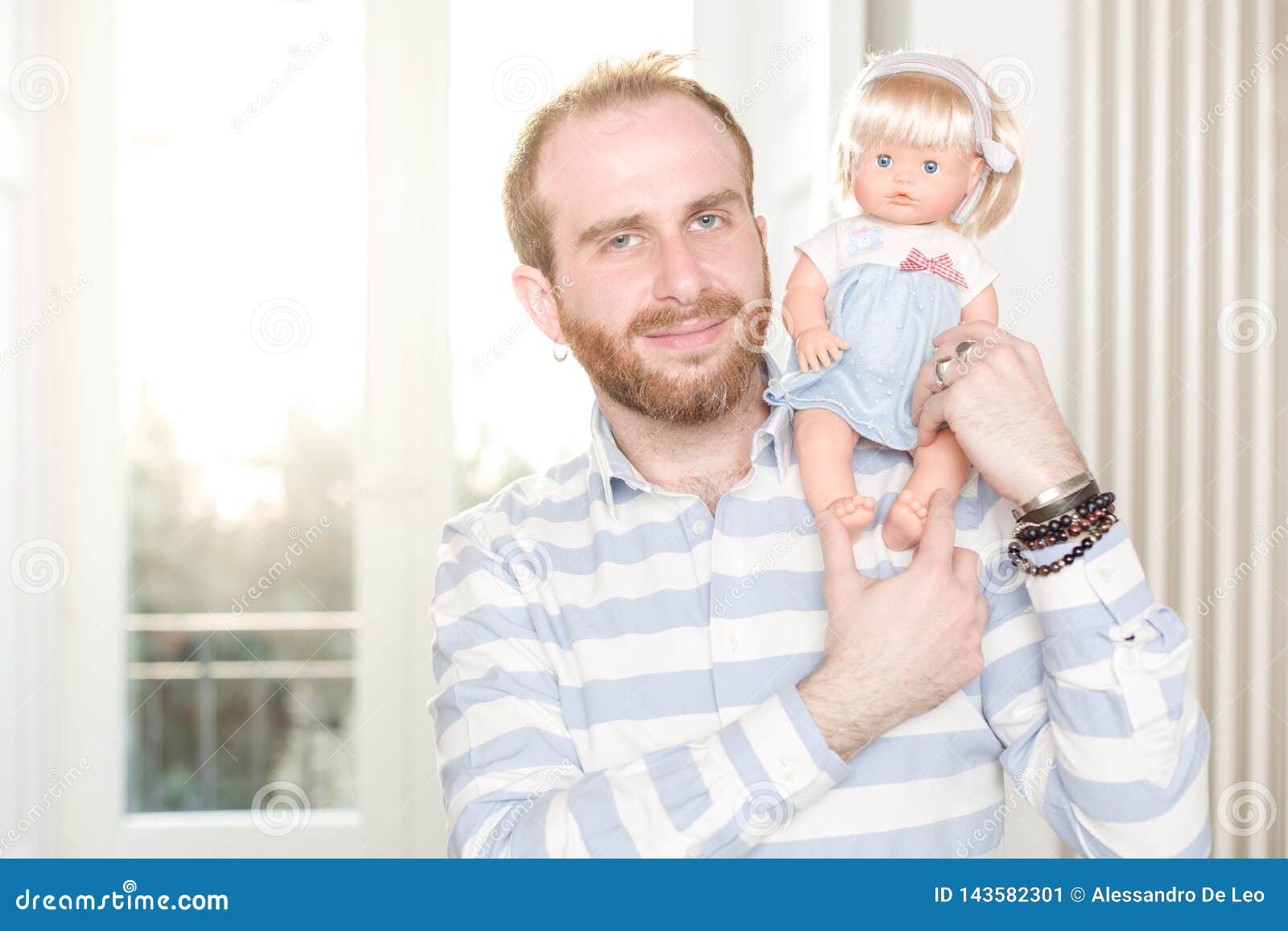 Man with a Doll stock image. Image of adult, female - 143582301