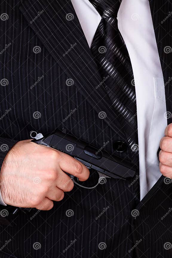 Man Drawing His Gun from Jacket Pocket Stock Photo - Image of holding ...