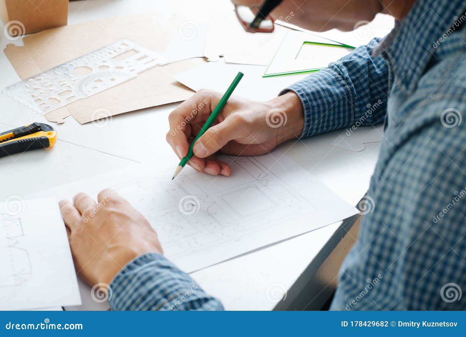 Man Drawing Scematics for Production of Boxes. Close Up. from Behind ...