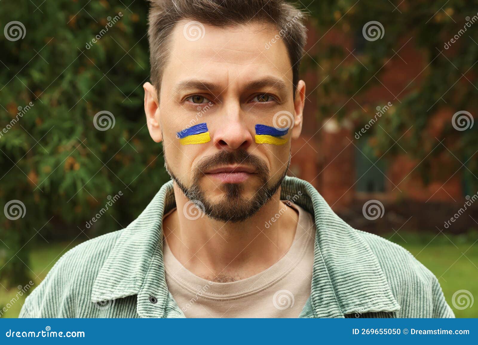 Man with Drawings of Ukrainian Flag on Face Outdoors Stock Photo ...
