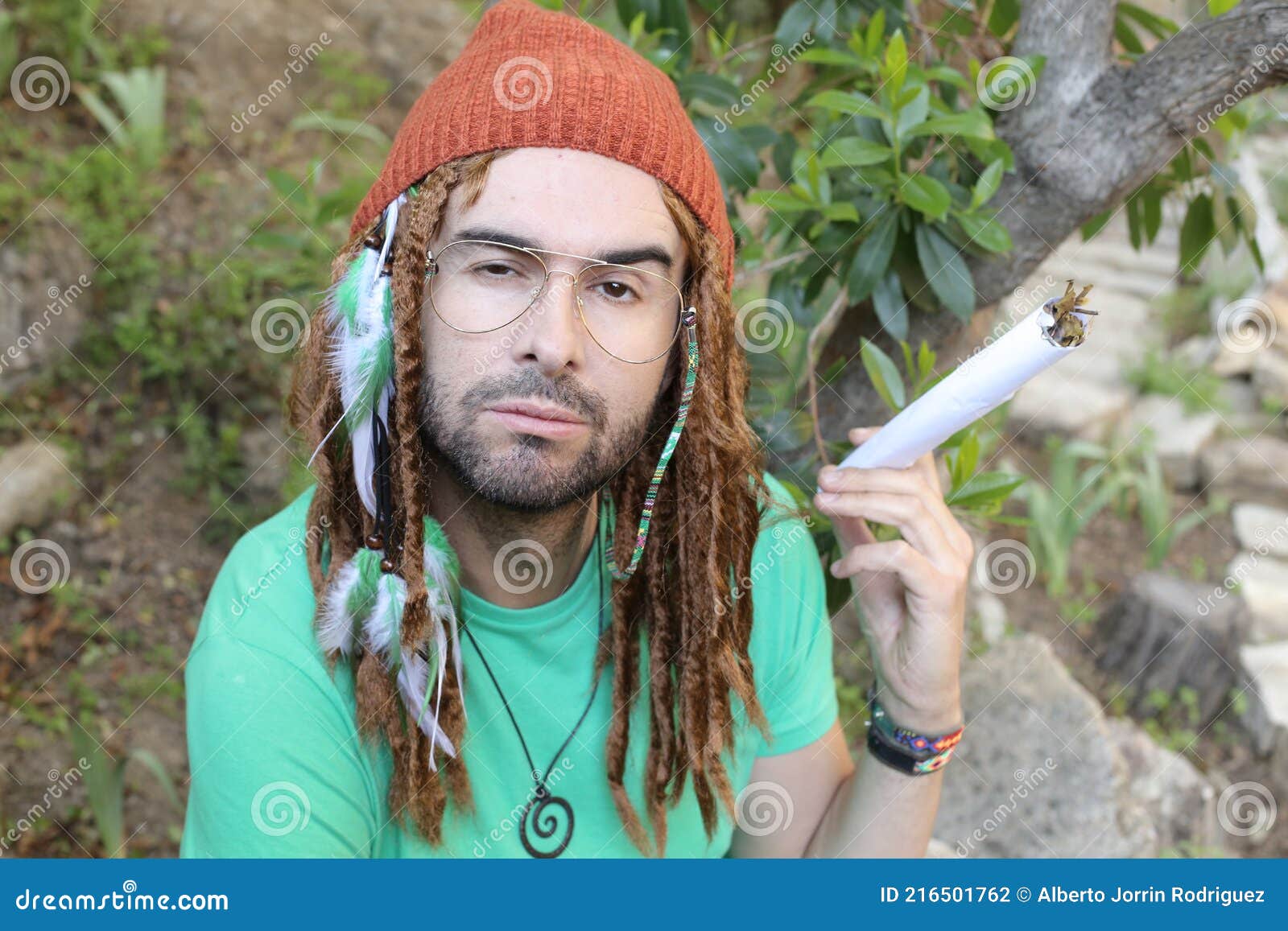 Man with Dreadlocks Smoking a Very Large Cigarette Stock Photo - Image ...