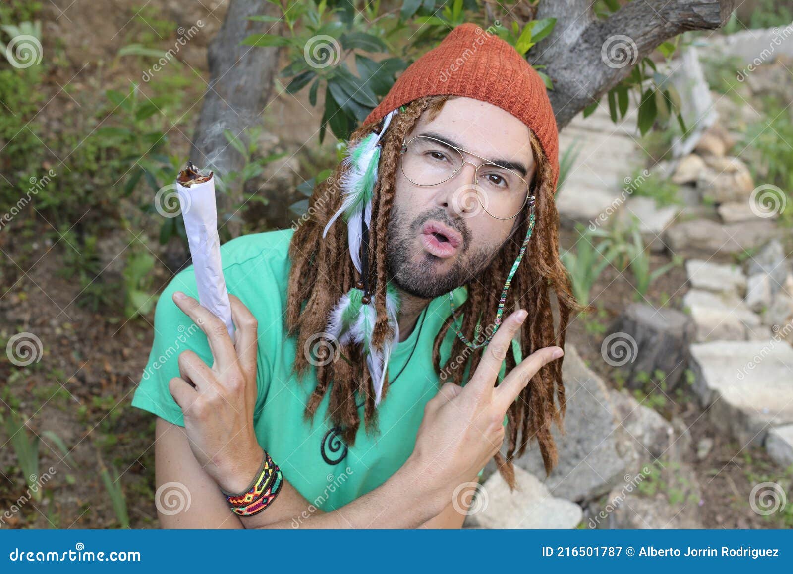 Man with Dreadlocks Smoking a Very Large Cigarette Stock Image - Image ...