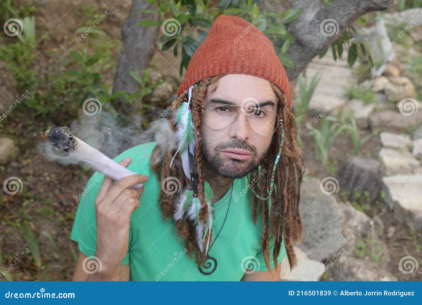 Man with Dreadlocks Smoking a Very Large Cigarette Stock Image - Image ...