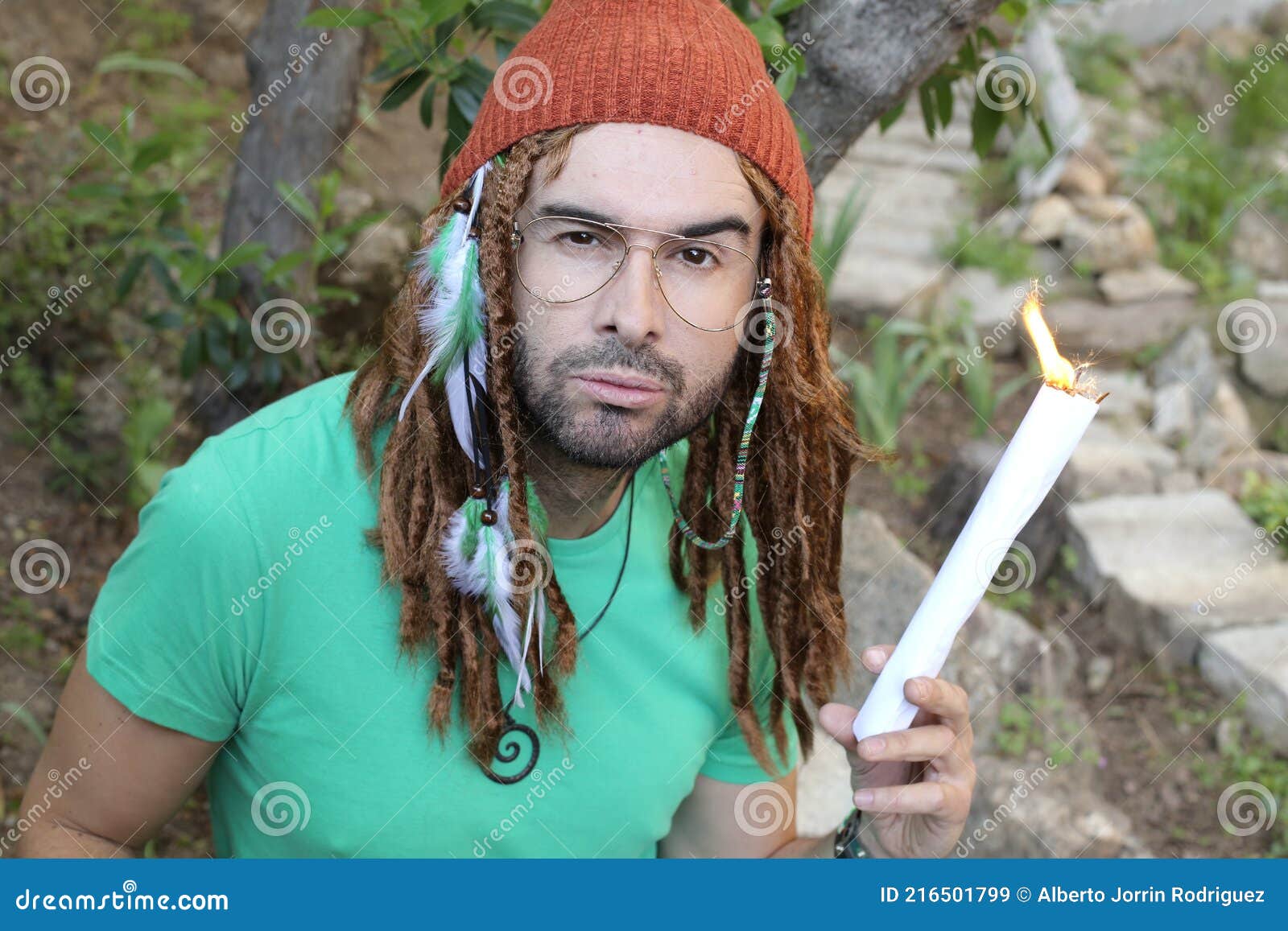 Man with Dreadlocks Smoking a Very Large Cigarette Stock Image - Image ...