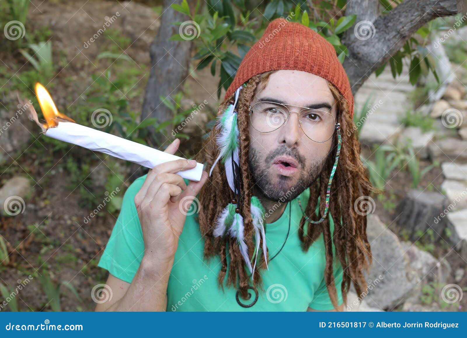 Man with Dreadlocks Smoking a Very Large Cigarette Stock Image - Image ...