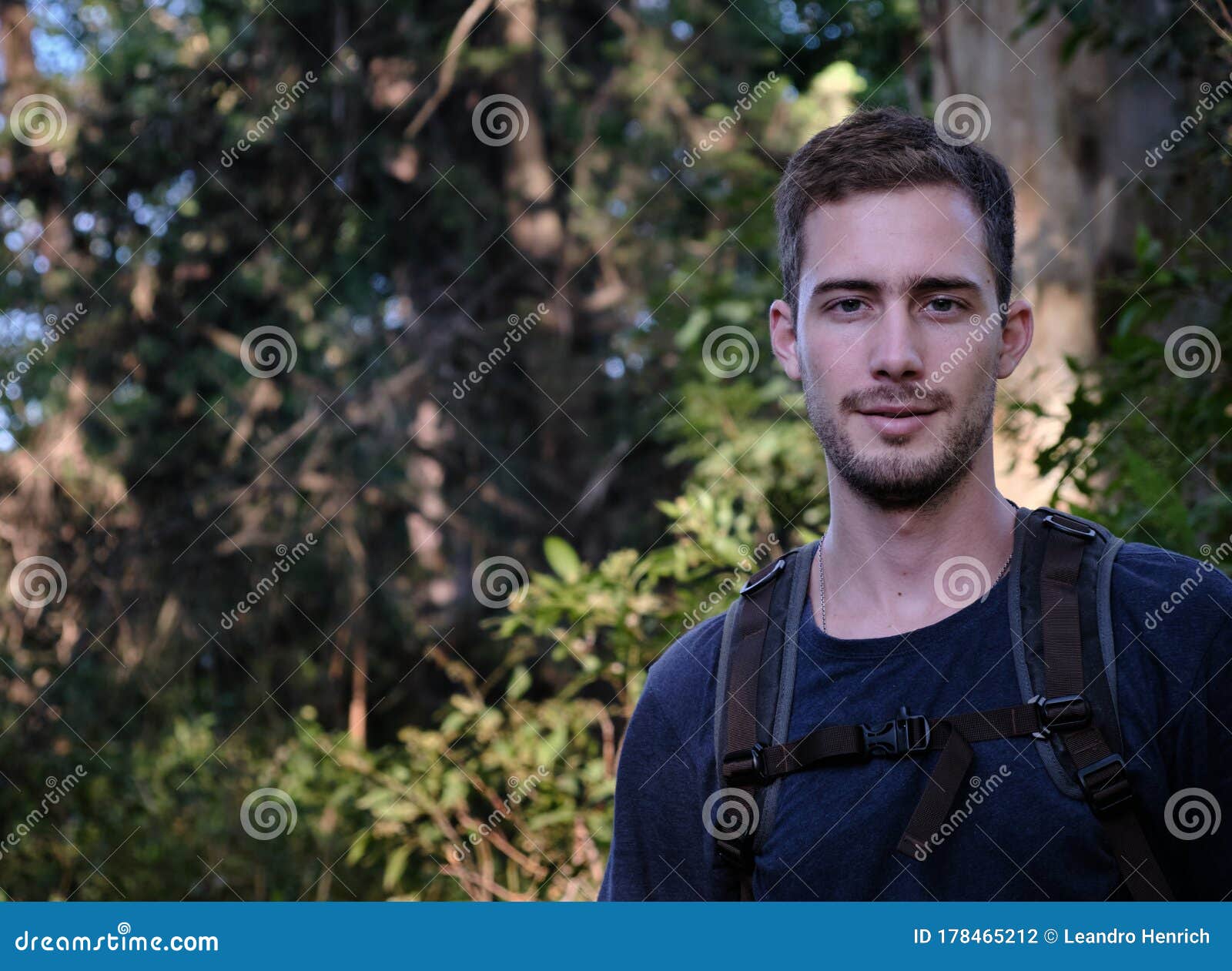 Man Dressed As a Hiker or Walker with a Background of Trees and ...