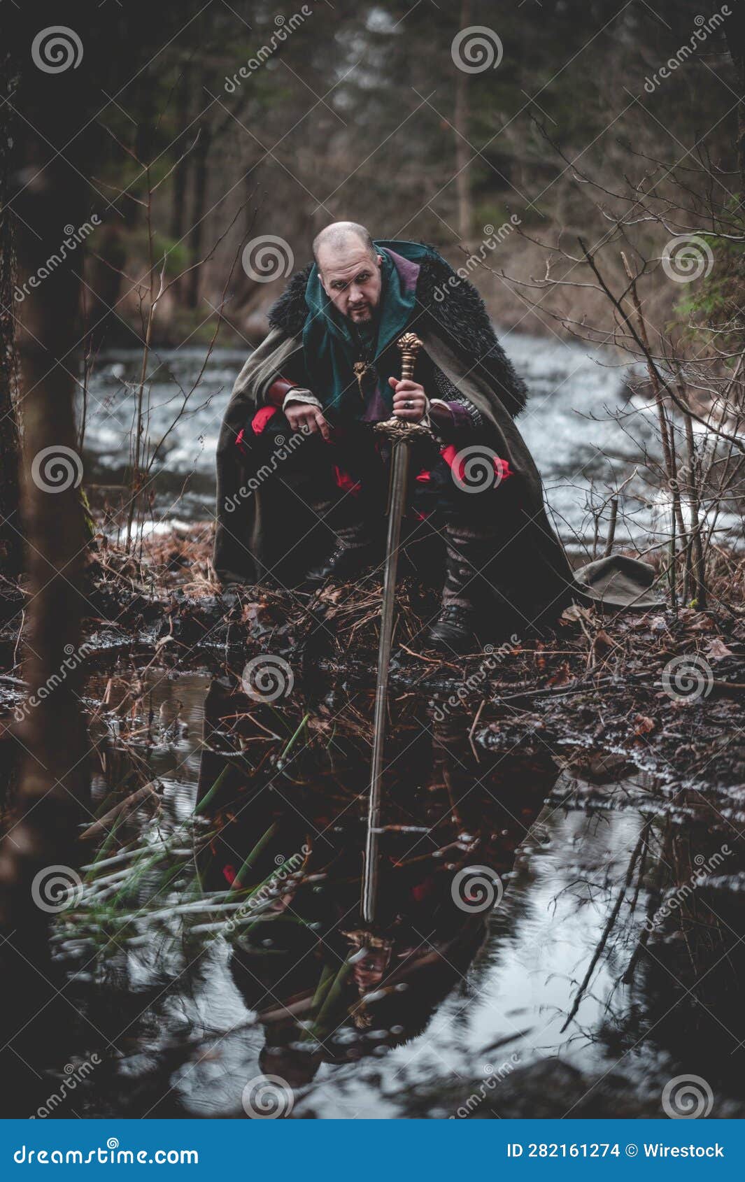 Man Dressed in Authentic Medieval Armor Standing in the Middle of ...