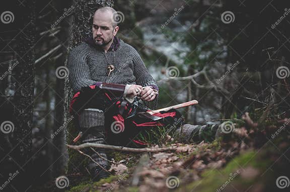 Man Dressed in Authentic Medieval Armor Standing in the Middle of ...