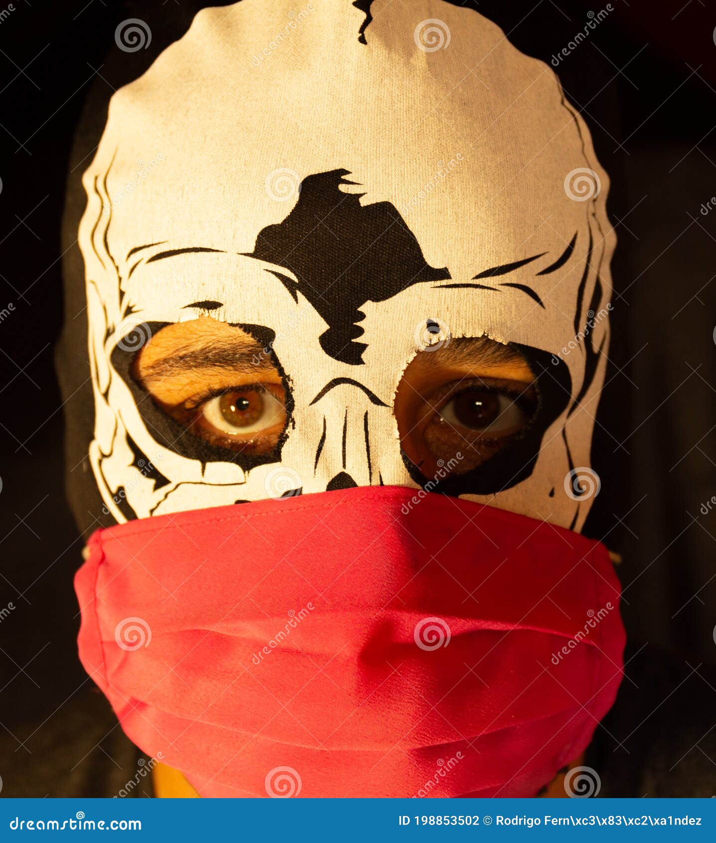 Man Dressed for Halloween with a Skeleton Mask with a Covid19 Face Mask ...