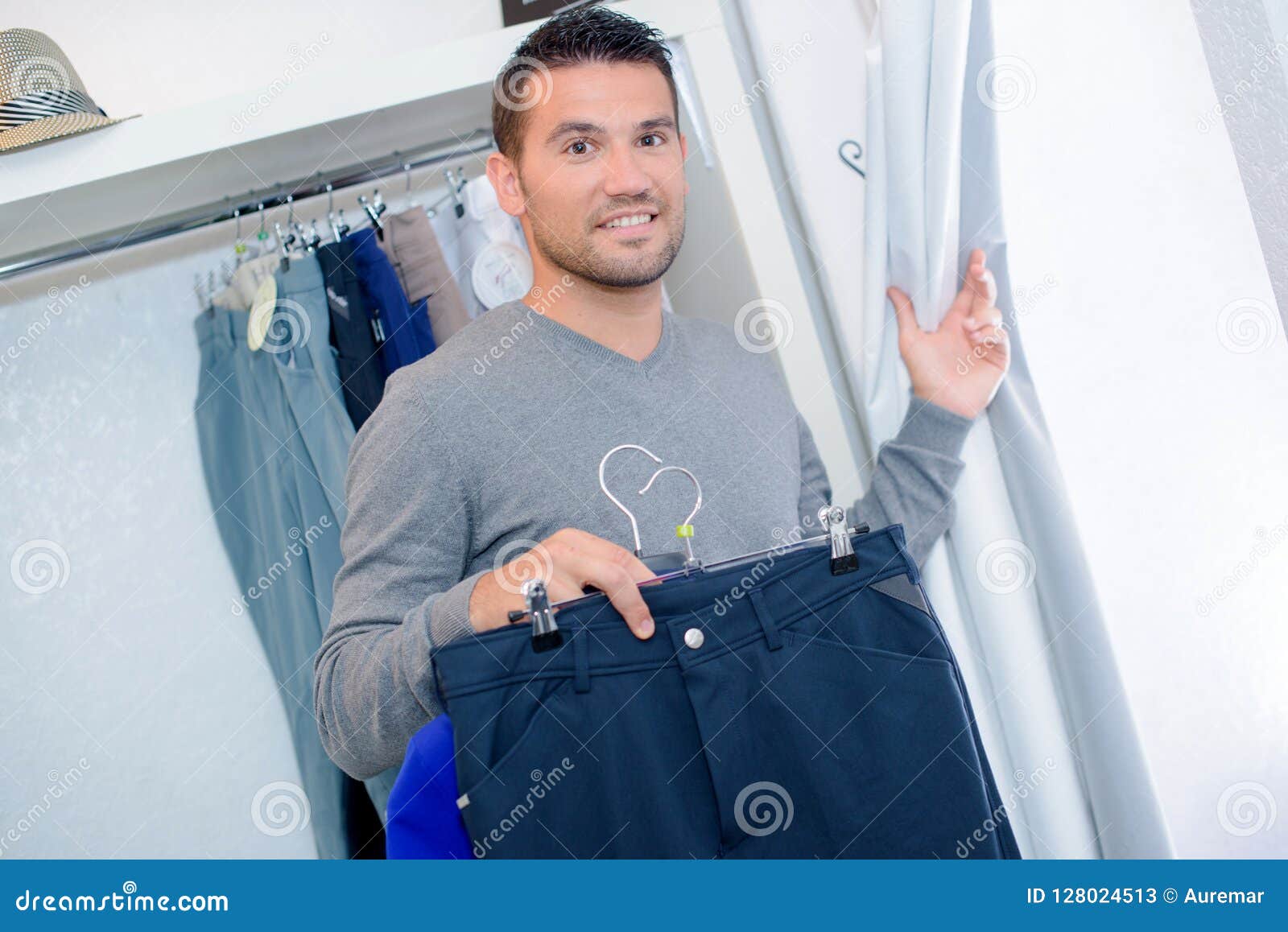 Man in dressing room stock image. Image of cabin, trousers - 128024513
