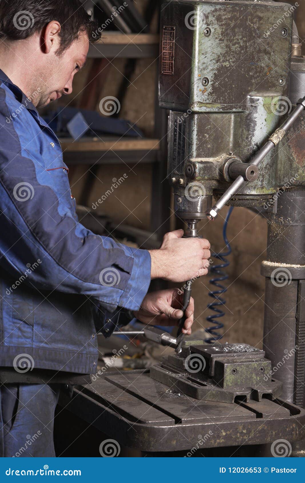 Man at drill machine stock image. Image of drilling, production - 12026653