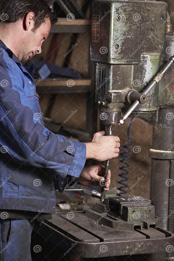 Man at drill machine stock image. Image of drilling, production - 12026653