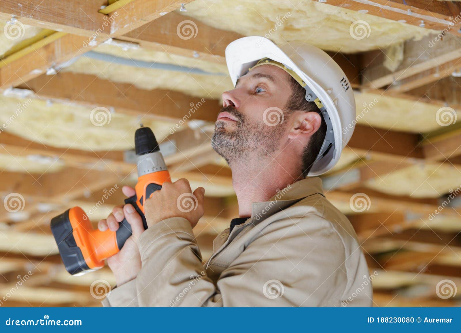Man drilling ceiling stock photo. Image of drilling - 188230080
