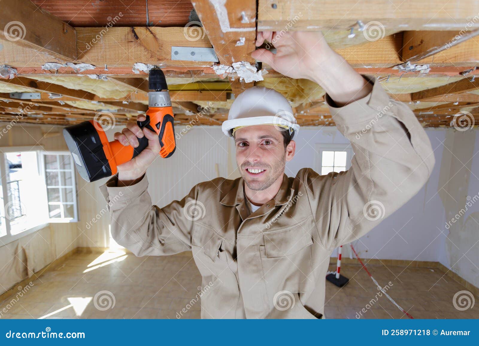 Man drilling ceiling stock photo. Image of male, home - 258971218