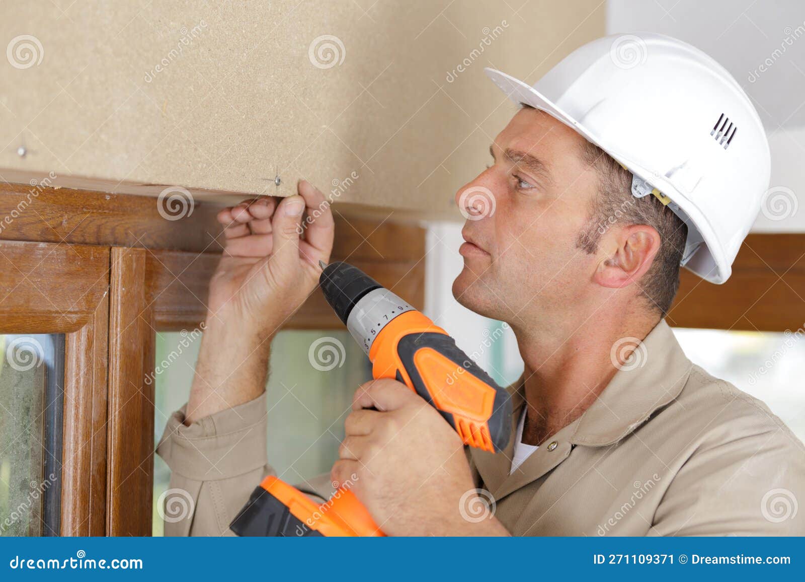 Man Drilling Hole in Window Frame Stock Image - Image of window ...