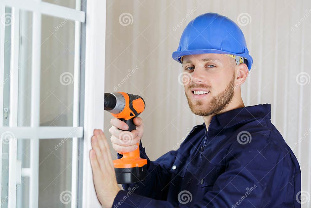 Man Drilling Hole in Window Frame Stock Photo - Image of indoors ...