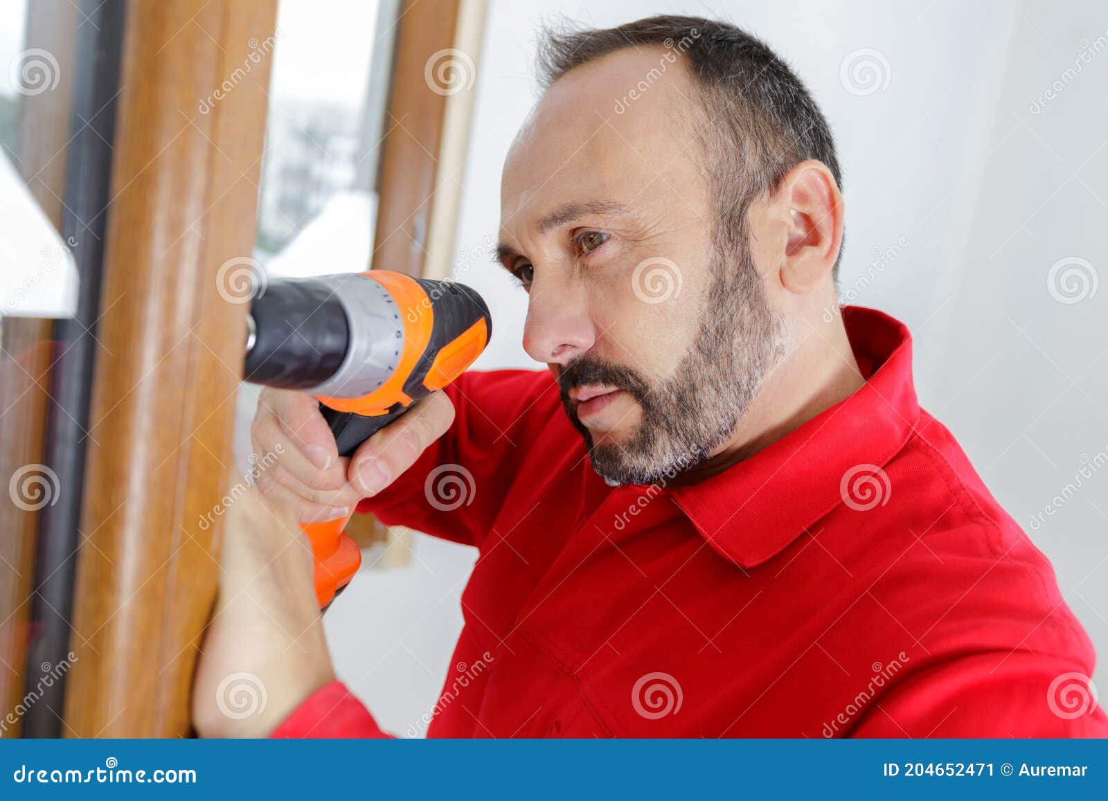Man drilling window stock image. Image of compression - 204652471