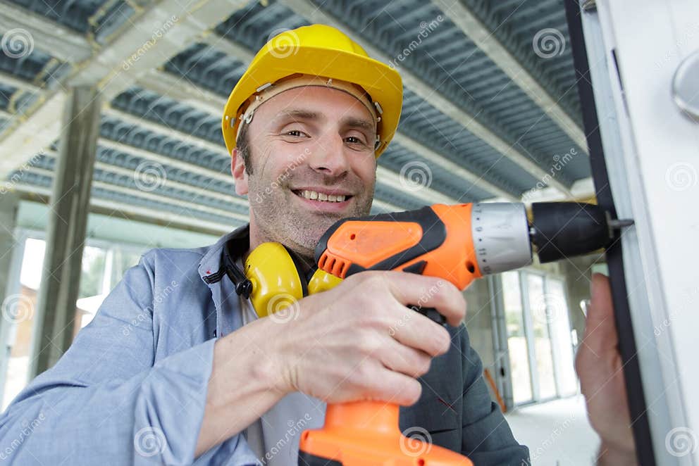 Man drilling window frame stock photo. Image of handyman - 281402882
