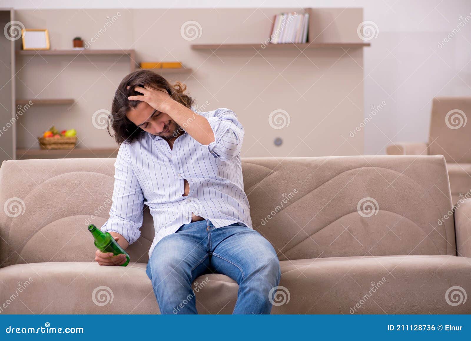 Young Man Drinking Alcohol at Home Stock Photo - Image of glass, couch ...