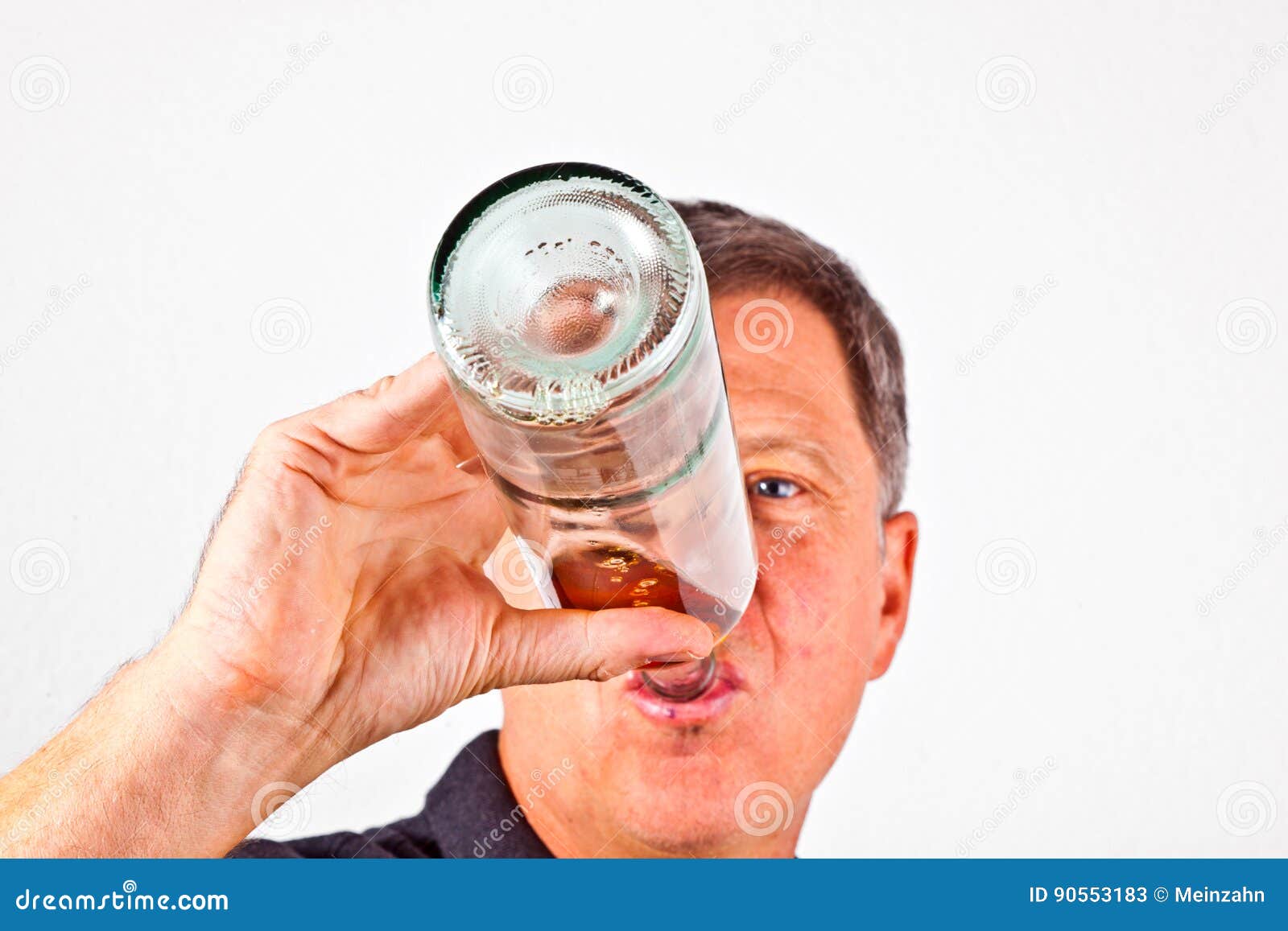 Man Drinking Alcohol Out of Bottle Stock Image - Image of grey, face ...