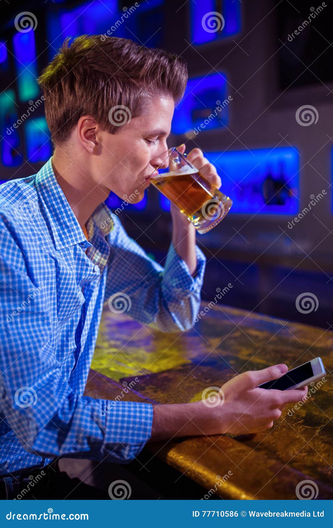Man Drinking Beer at Bar Counter Stock Photo - Image of handsome, event ...