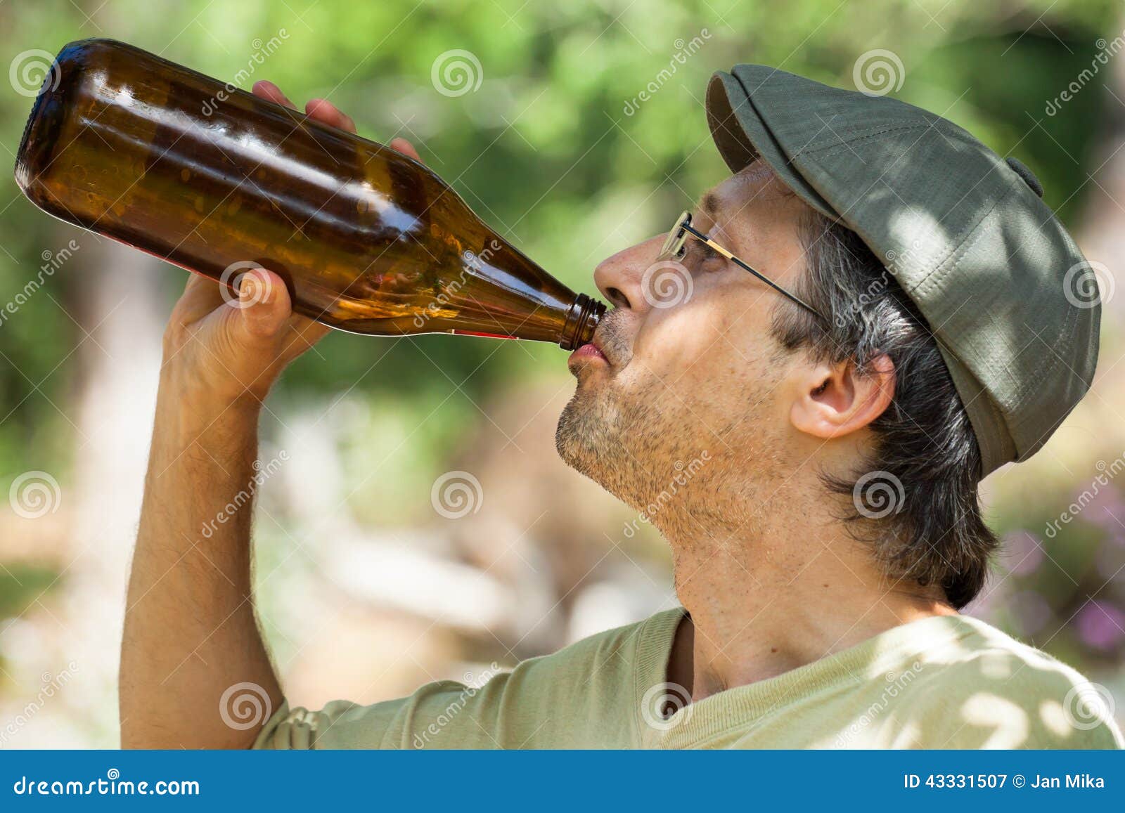 Man Drinking Beer from Bottle Stock Image - Image of addict, natural: 43331507
