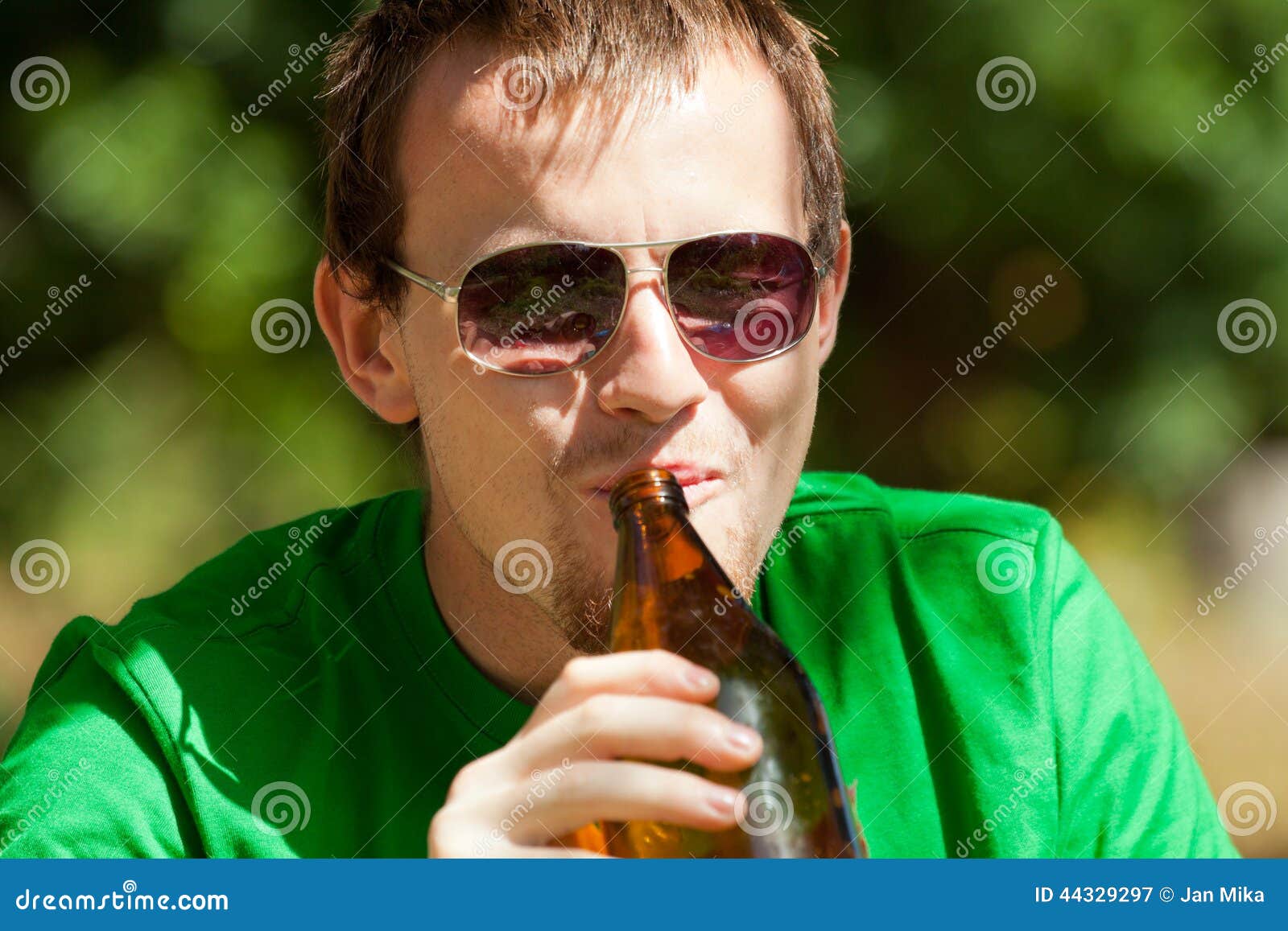 Man Drinking Beer from Bottle Stock Image - Image of garden, nature ...