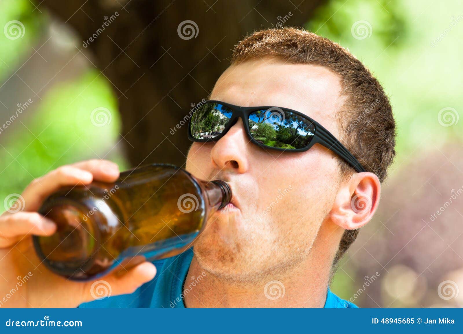 Man Drinking Beer from Bottle Stock Image - Image of nature, addiction ...