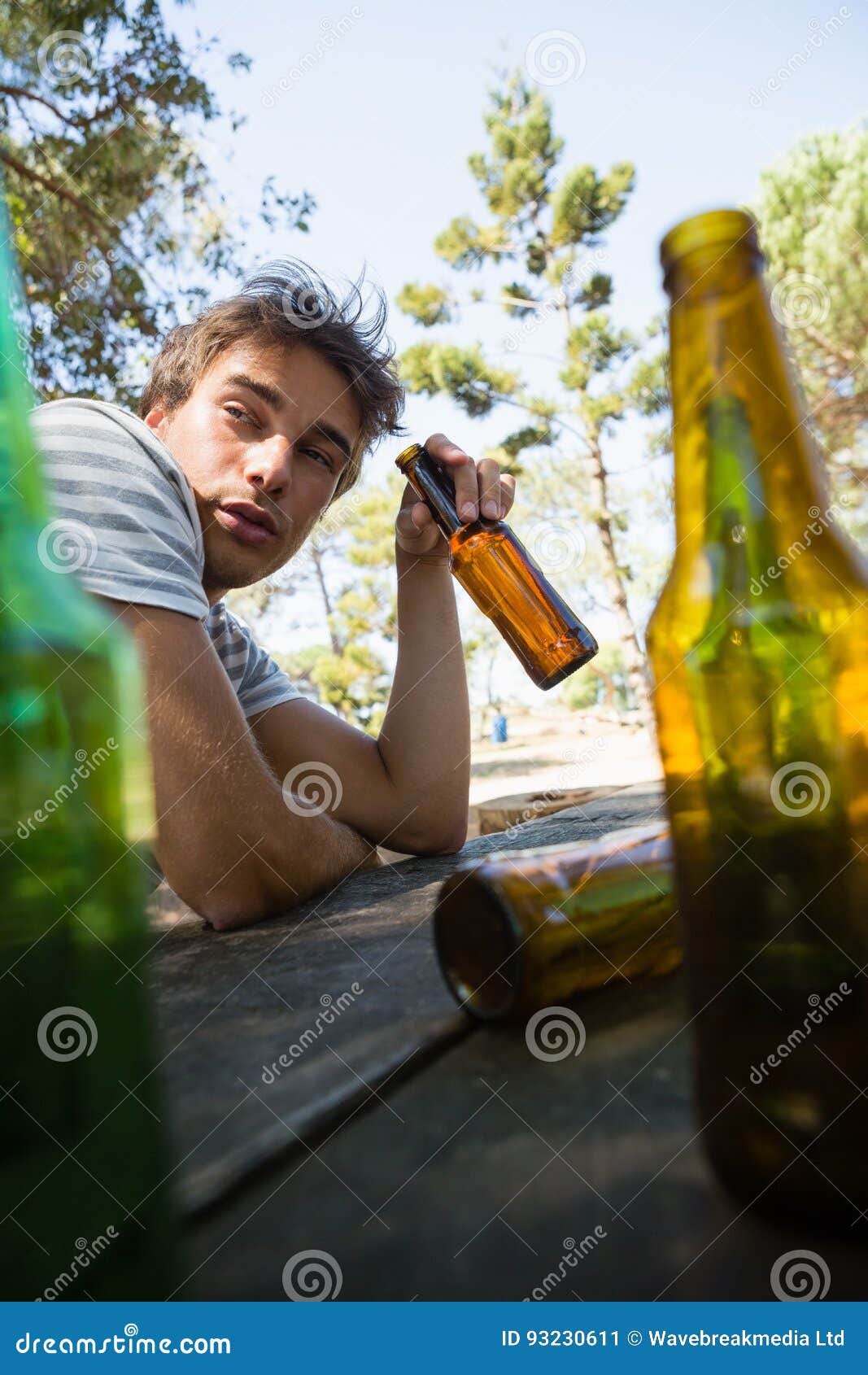 Man Drinking Beer from Bottle in the Park Stock Image - Image of ...