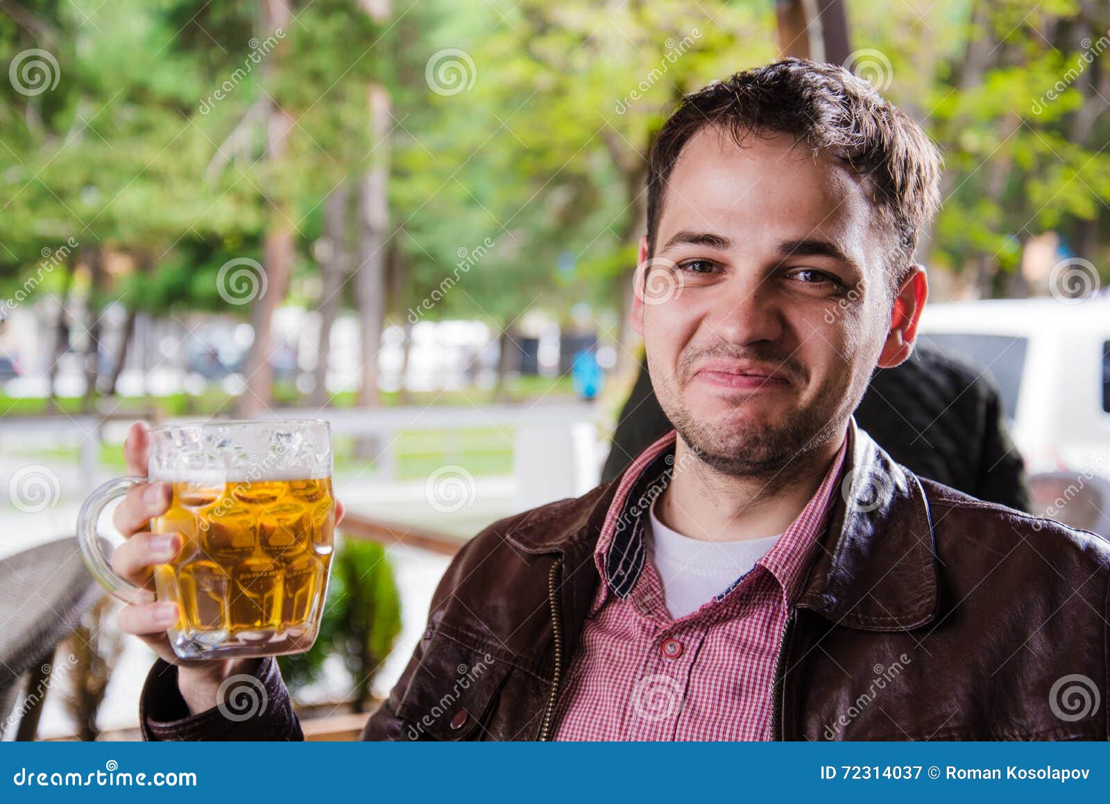 Man Drinking Beer Outdoors in a Cafe with Funny Expressions Stock Image ...