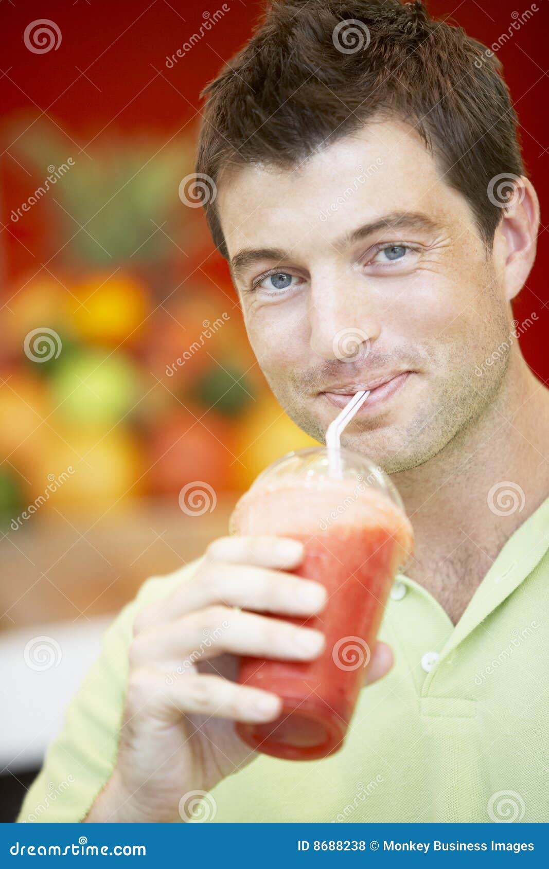 Man Drinking a Berry Smoothie Stock Photo - Image of drinking, colour ...