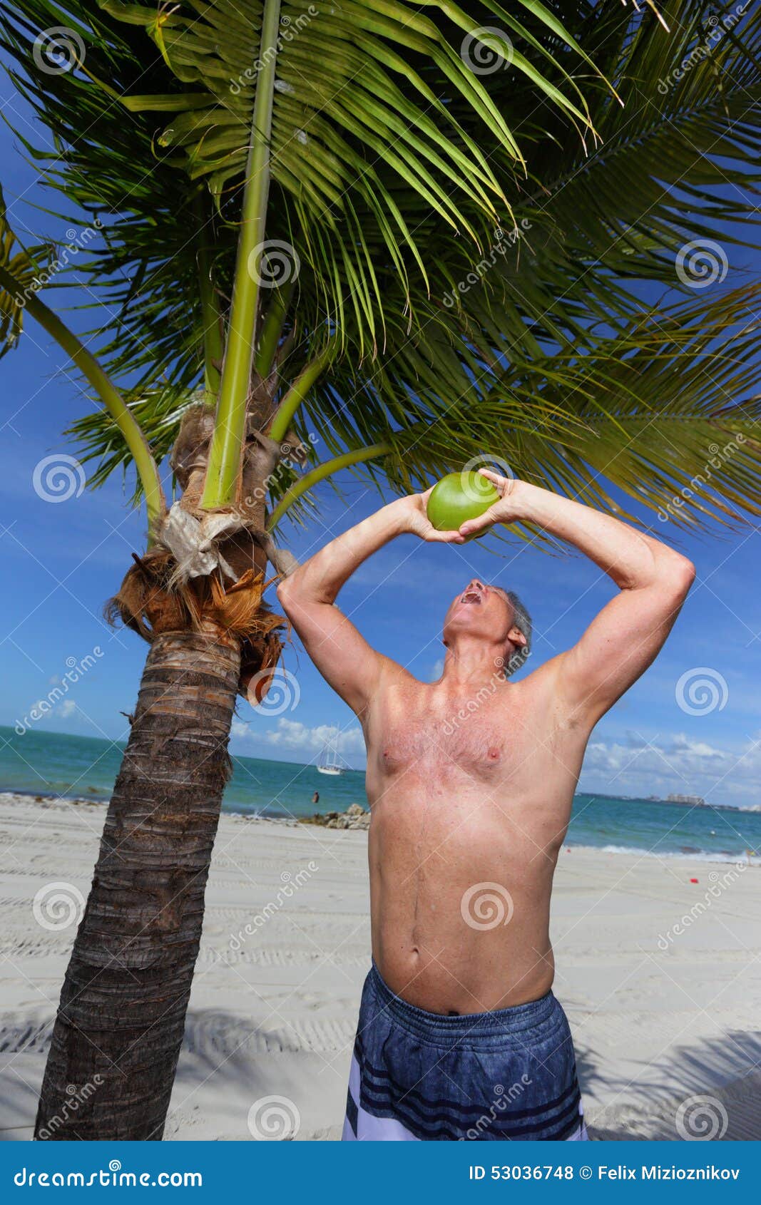 Man Drinking Coconut Water on the Beach Stock Photo - Image of sync ...