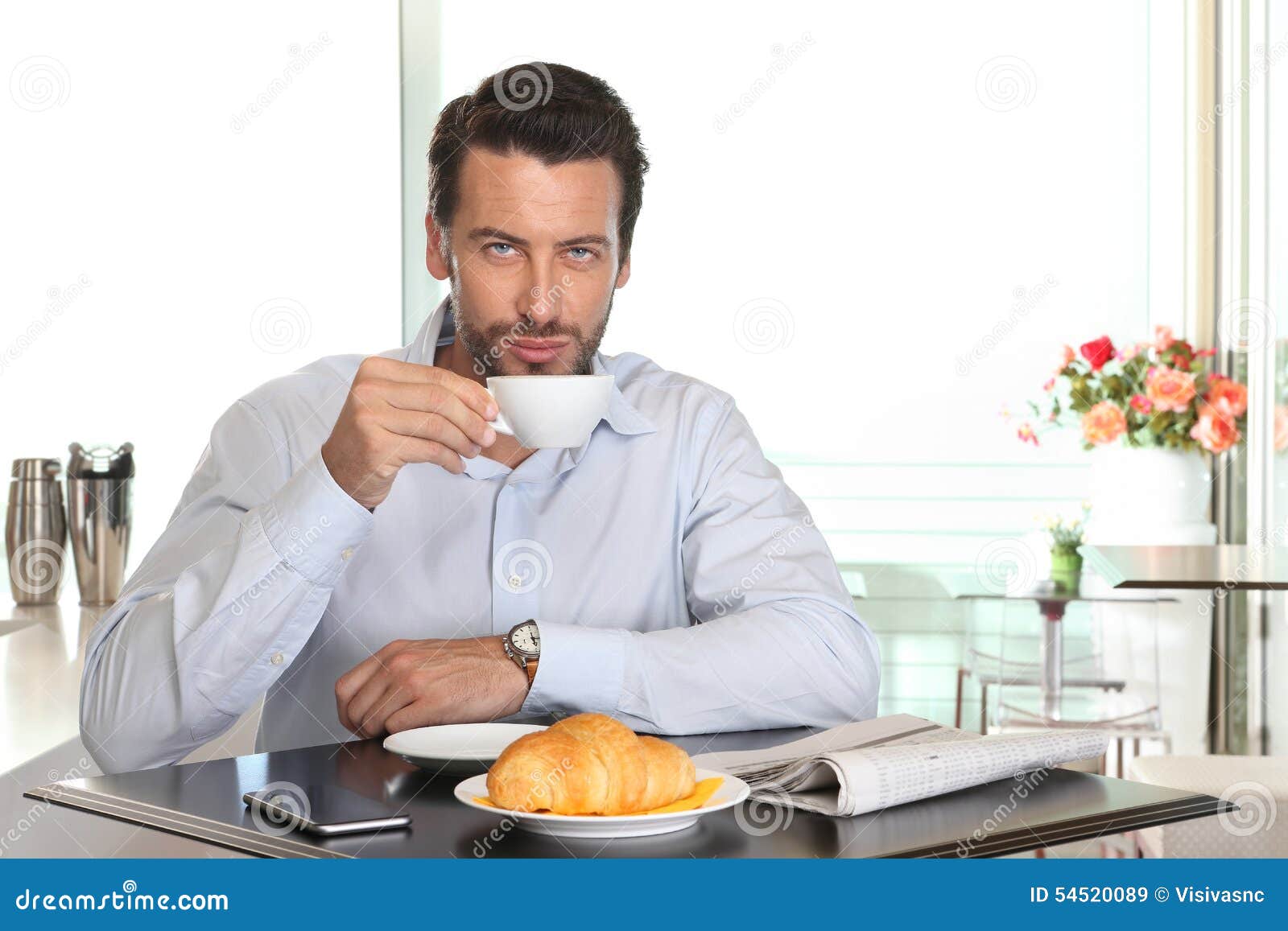 Man Drinking Coffee in Cafe with Croissant and Newspaper on Table Stock ...