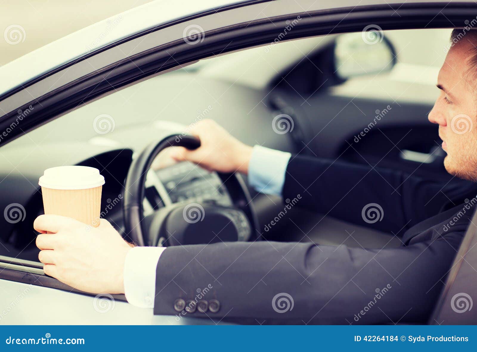 Man Drinking Coffee while Driving the Car Stock Photo - Image of ...