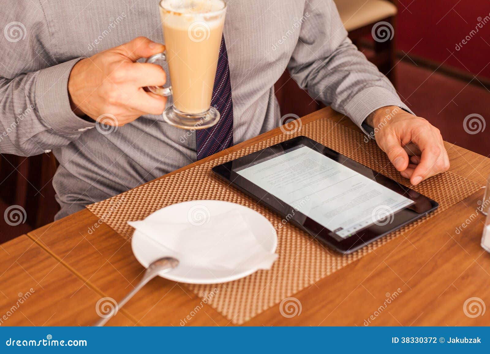 Man Drinking Coffee and Using Tablet Computer. Stock Photo - Image of ...