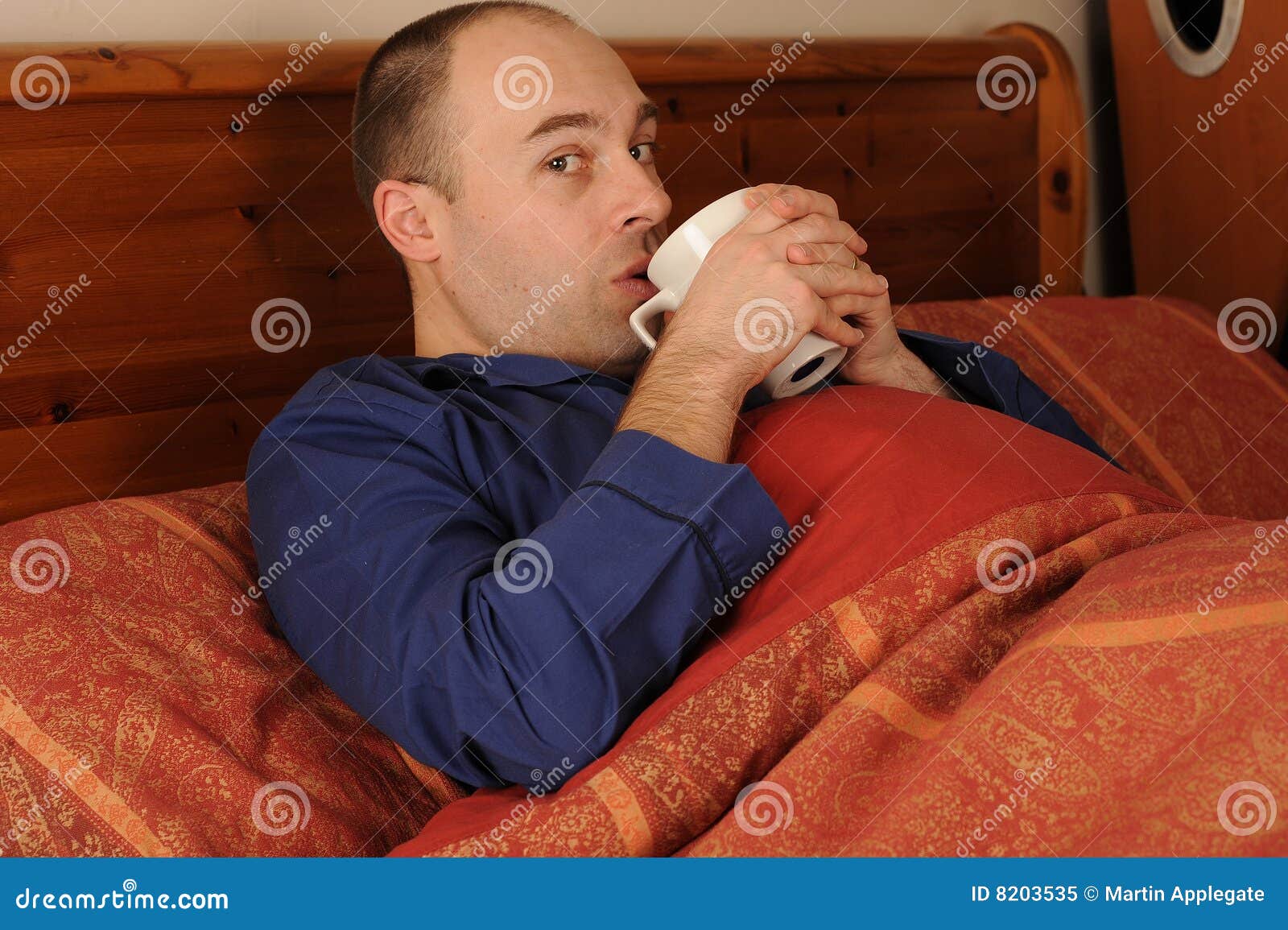 Man Drinking from Cup in Bed Stock Image - Image of comfy, duvet: 8203535