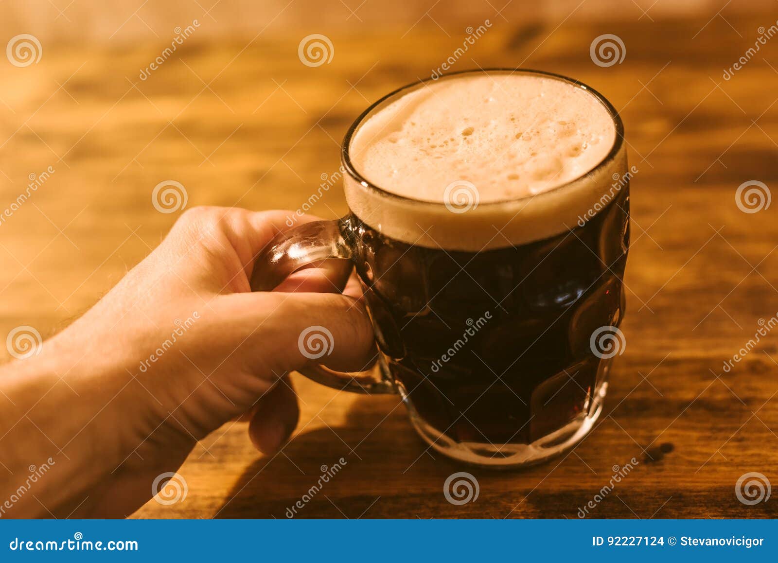 Man Drinking Dark Beer in British Dimpled Glass Pint Mug Stock Photo ...