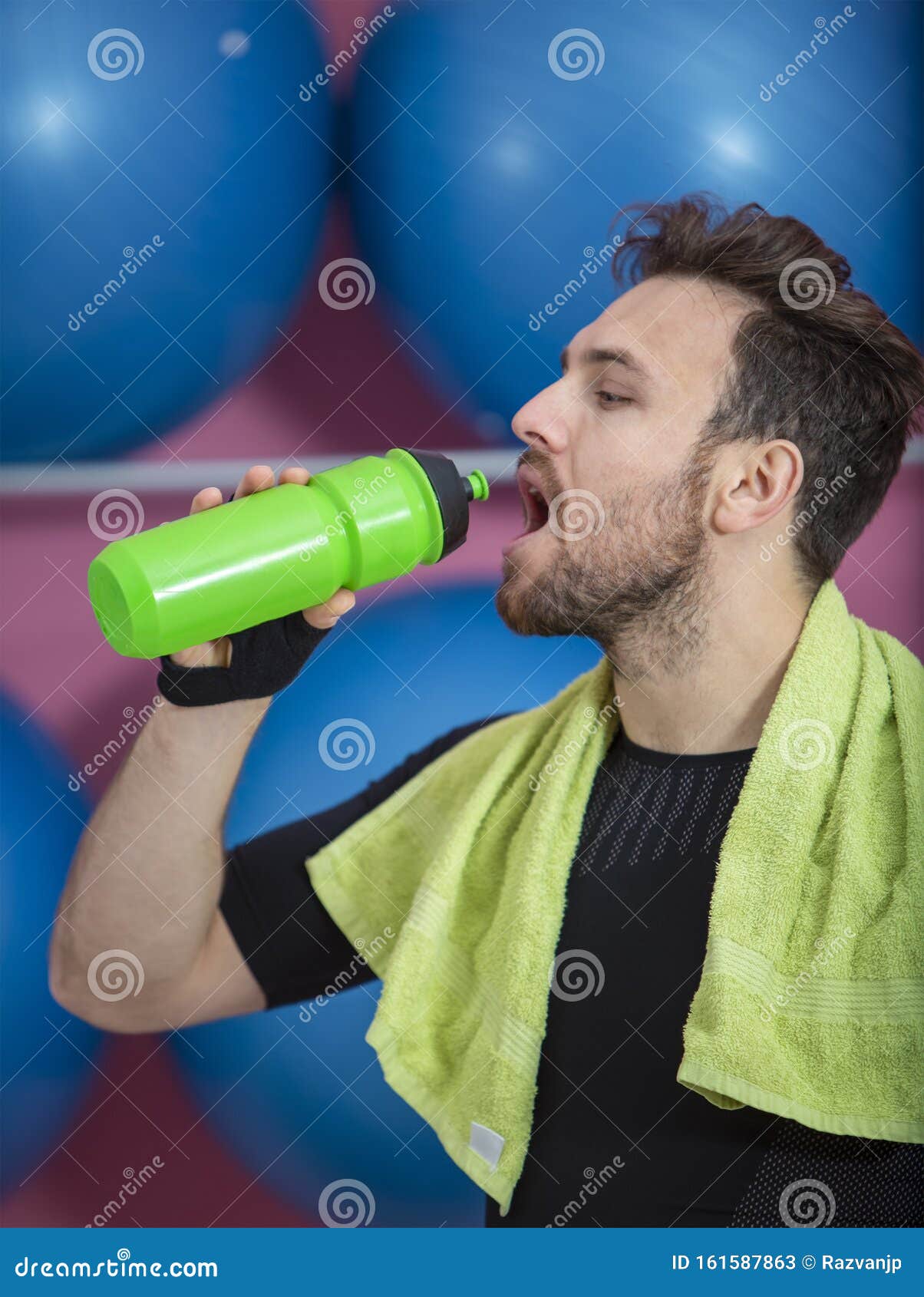 Man Drinking in a Gym stock image. Image of portrait - 161587863