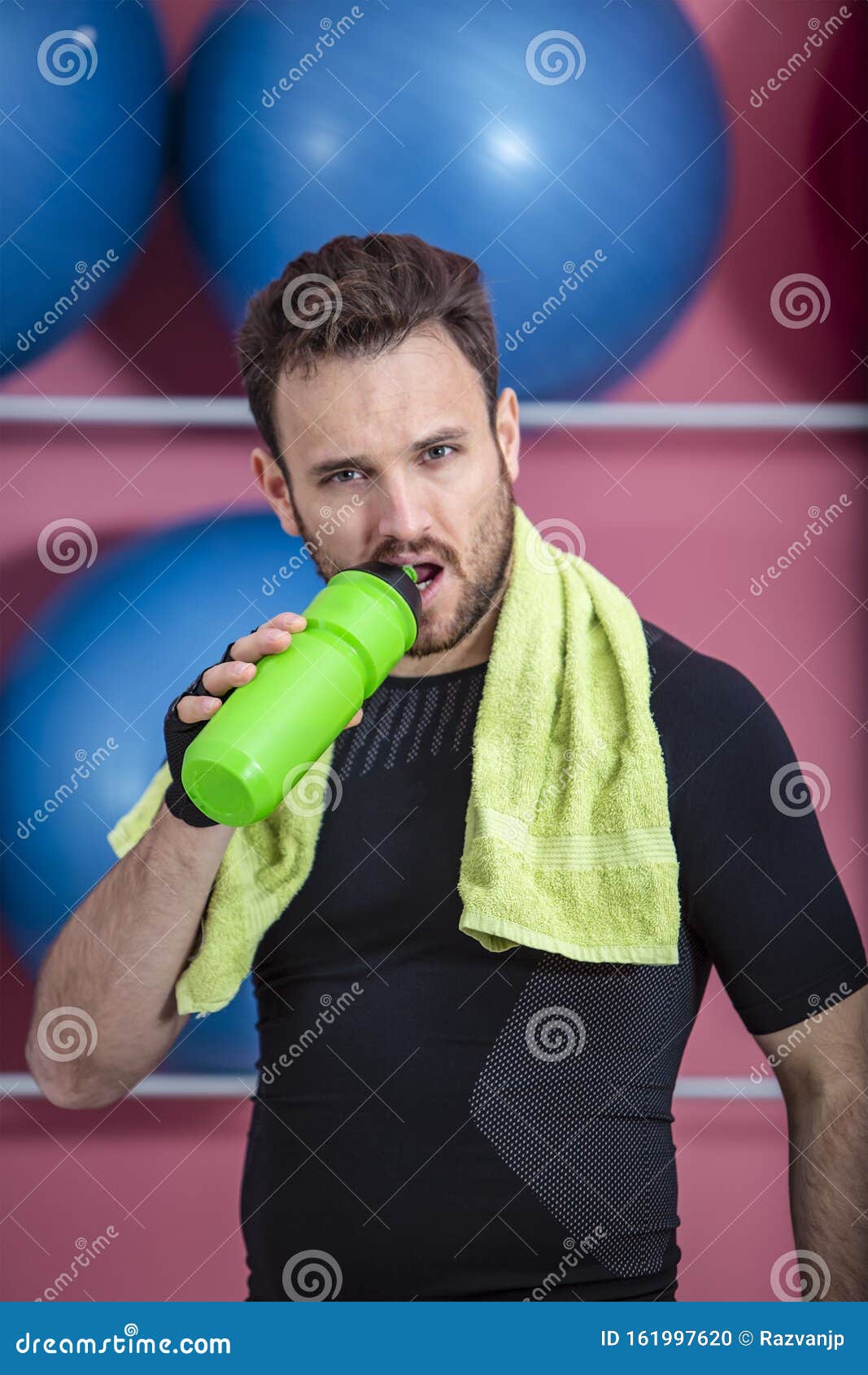 Man Drinking in a Gym stock photo. Image of leisure - 161997620