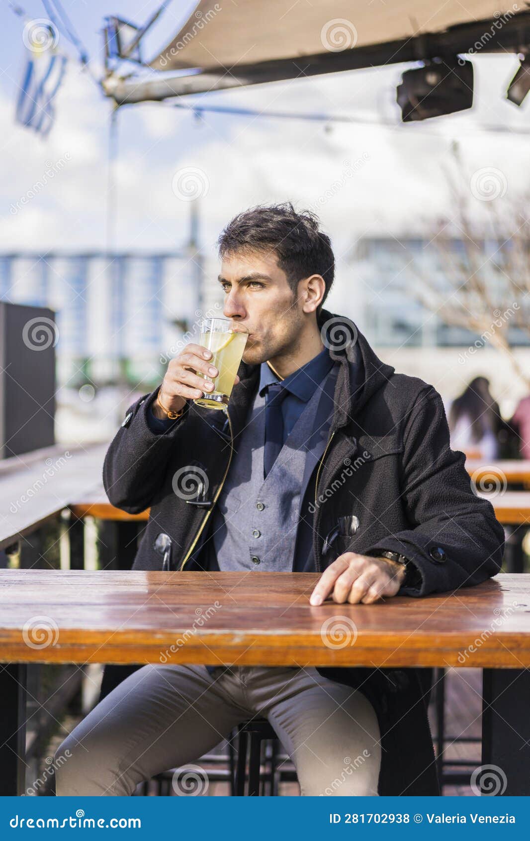 Man Drinking a Lemonade while Sitting in a Bar at the Harbor Stock ...