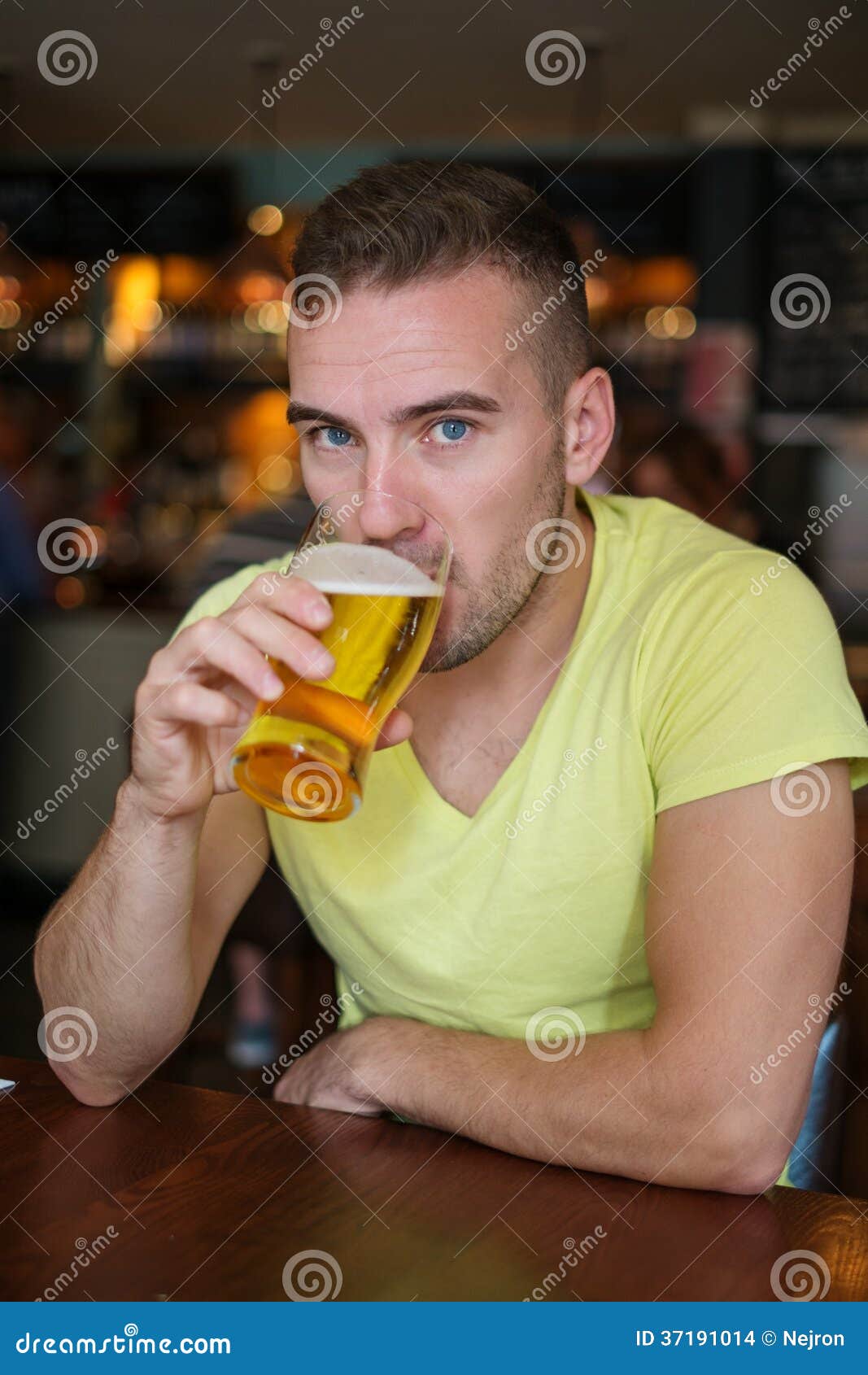 Man Drinking Light Beer in a Pub Stock Photo - Image of alone ...