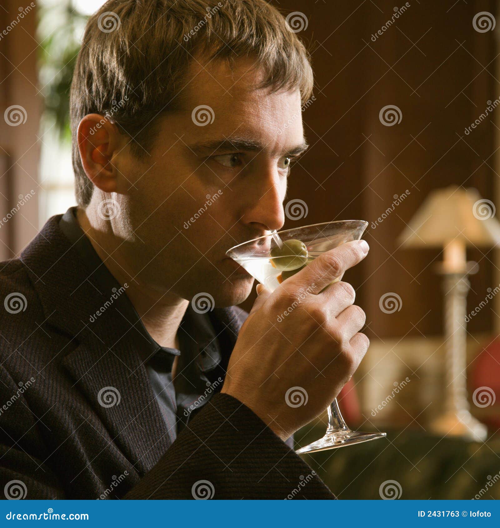 Man drinking martini. stock image. Image of cocktail, drink - 2431763
