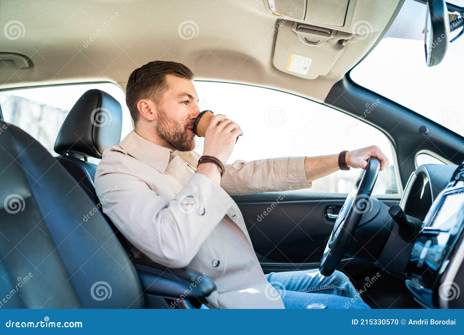 Man Drinking Morning Coffee while Driving Car. Stock Photo - Image of ...