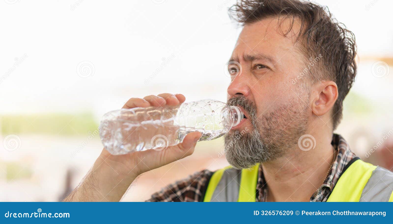 Man Drinking Water at the Precast Factory Site, Engineer Man Drinking ...